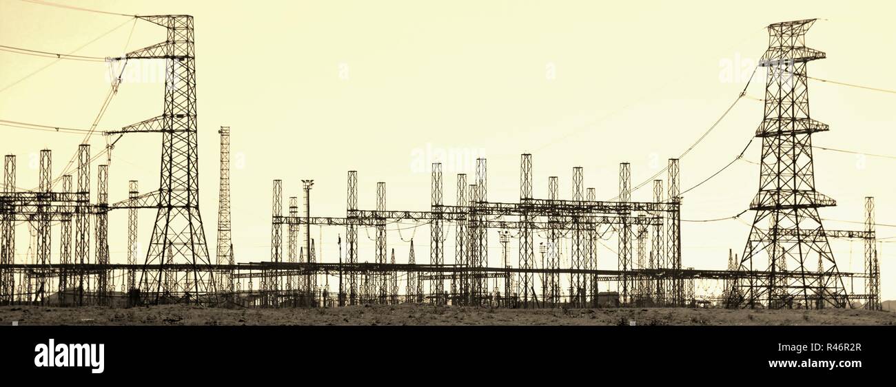 electricity pylons in the morning light Stock Photo - Alamy