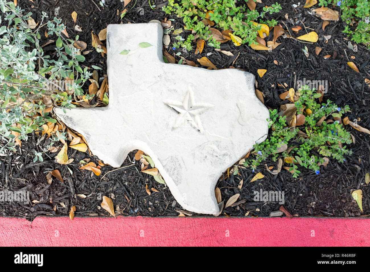 White stone in a shape of the state of Texas with a Lone Star symbol ...