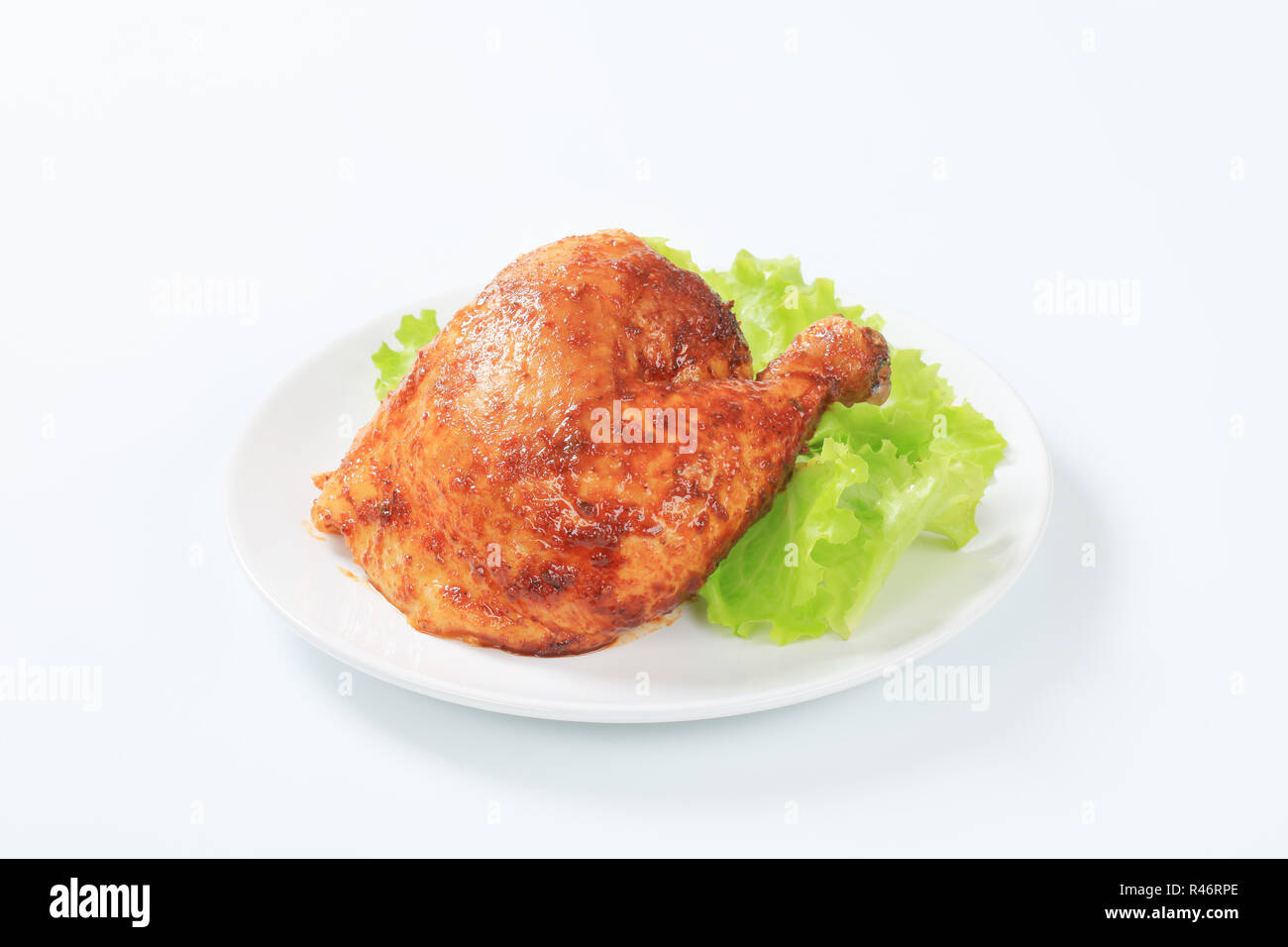 Garlic roasted chicken leg Stock Photo - Alamy