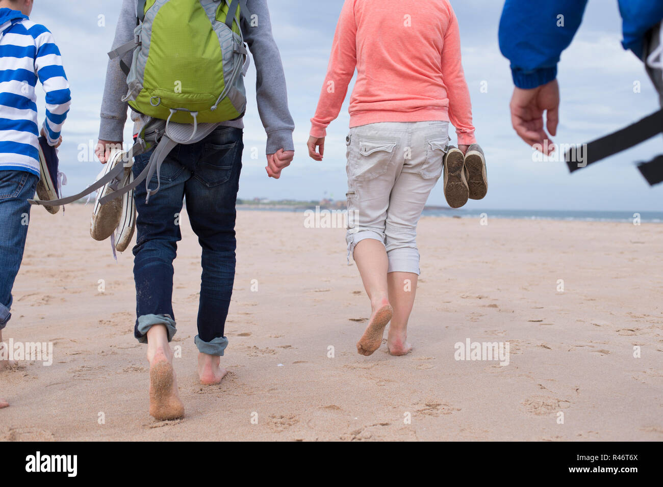 Sand between our toes Stock Photo - Alamy