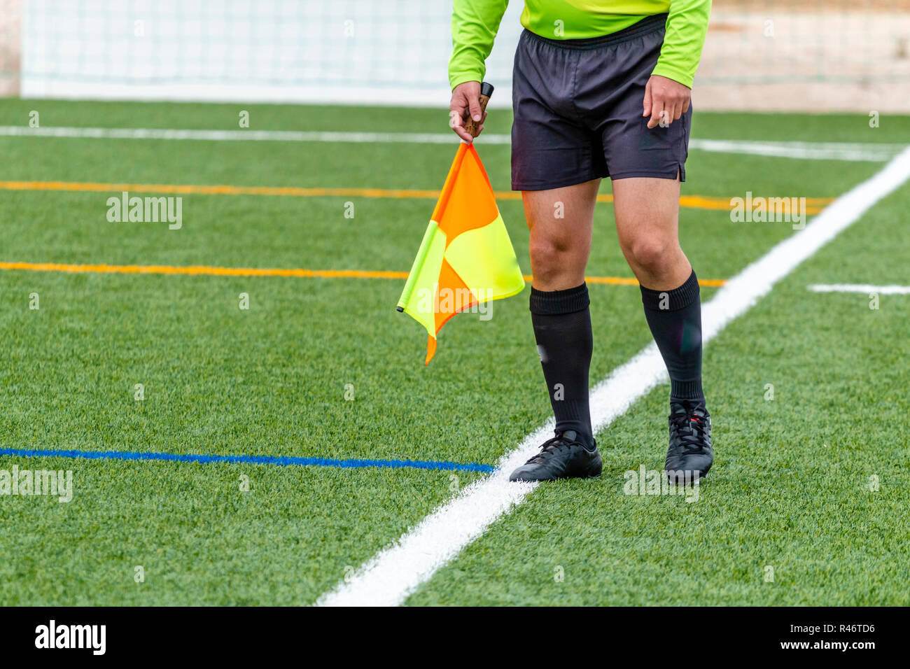 Assistant referee hold flag Stock Photo - Alamy