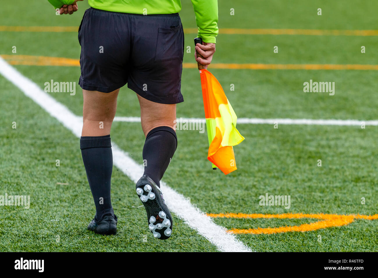 Assistant referee hold flag Stock Photo - Alamy