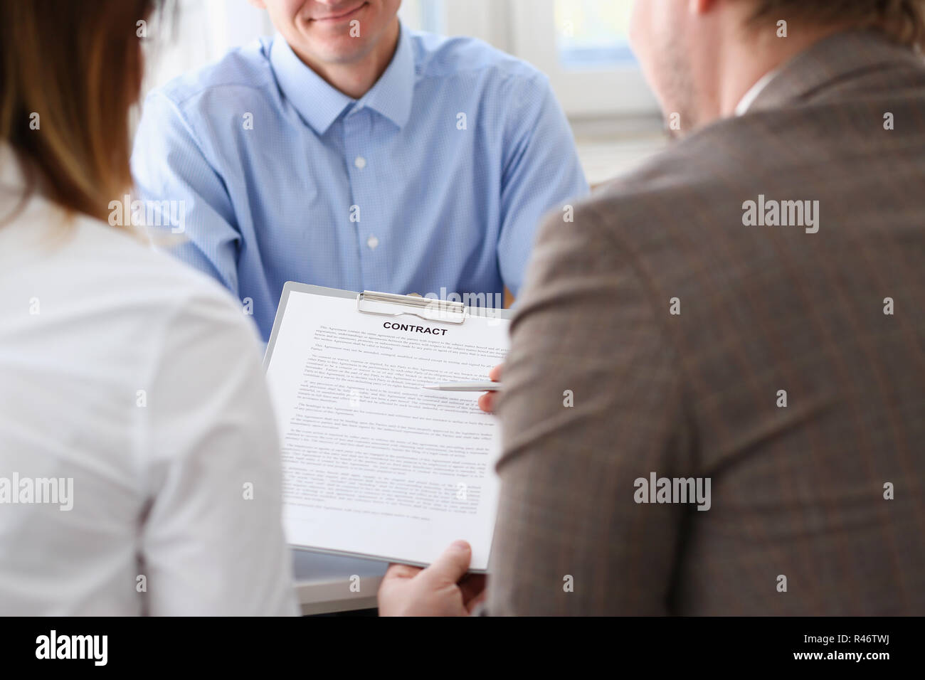 Businessman in blue shirt offer contract form on clipboard Stock Photo ...