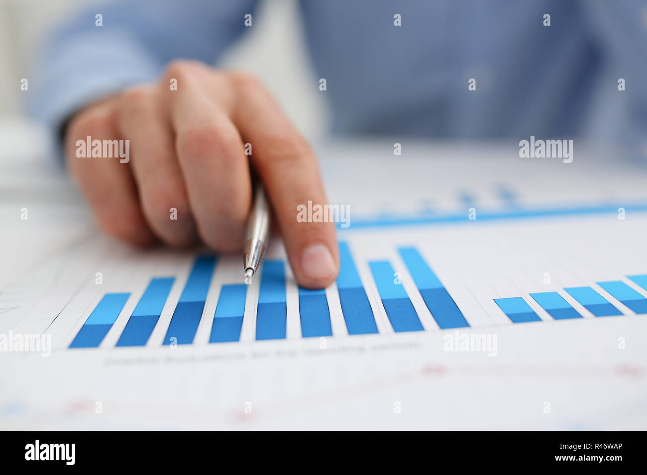 Group of people deliberate on problem with infographics Stock Photo - Alamy