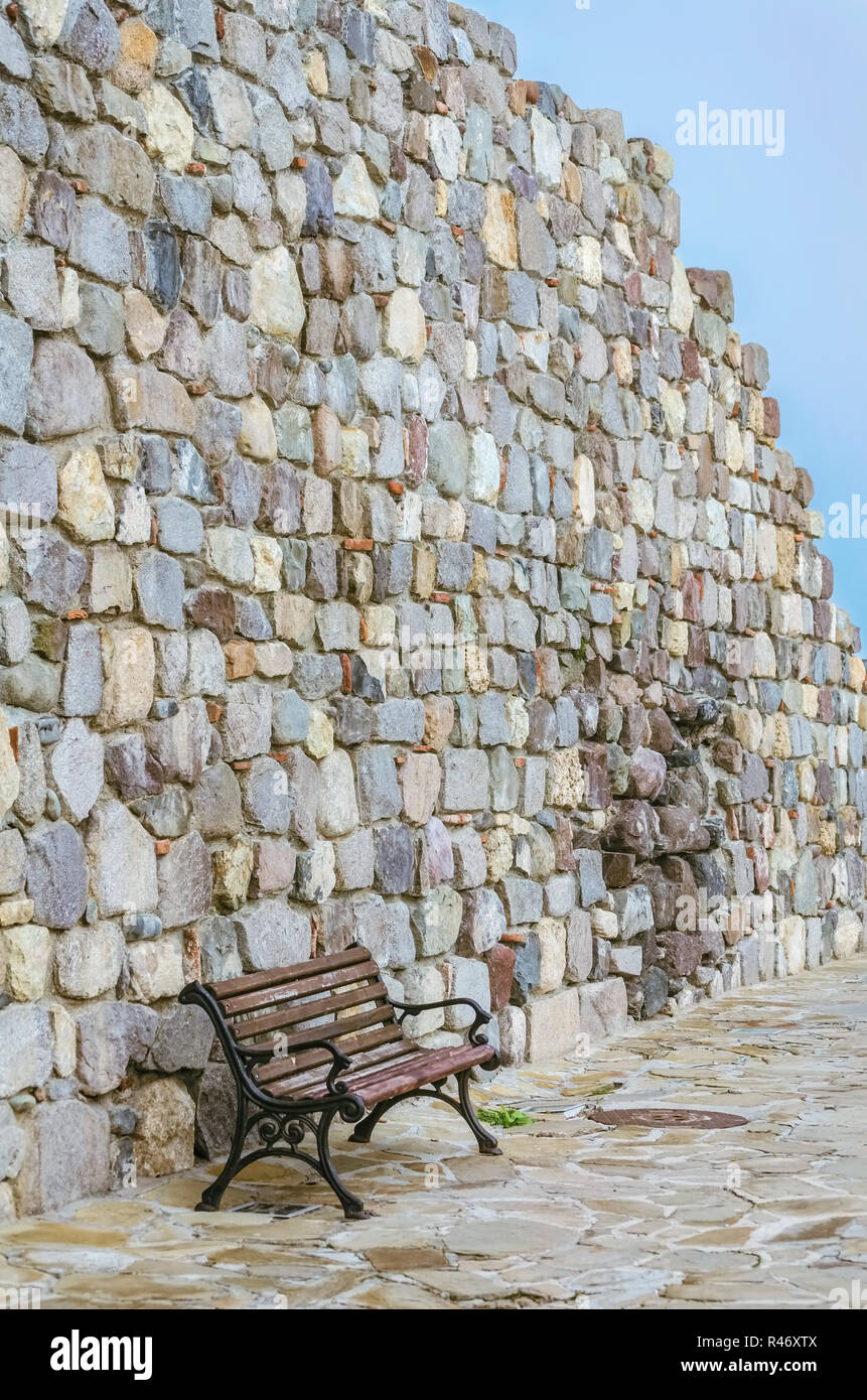 Bench near the Wall Stock Photo - Alamy