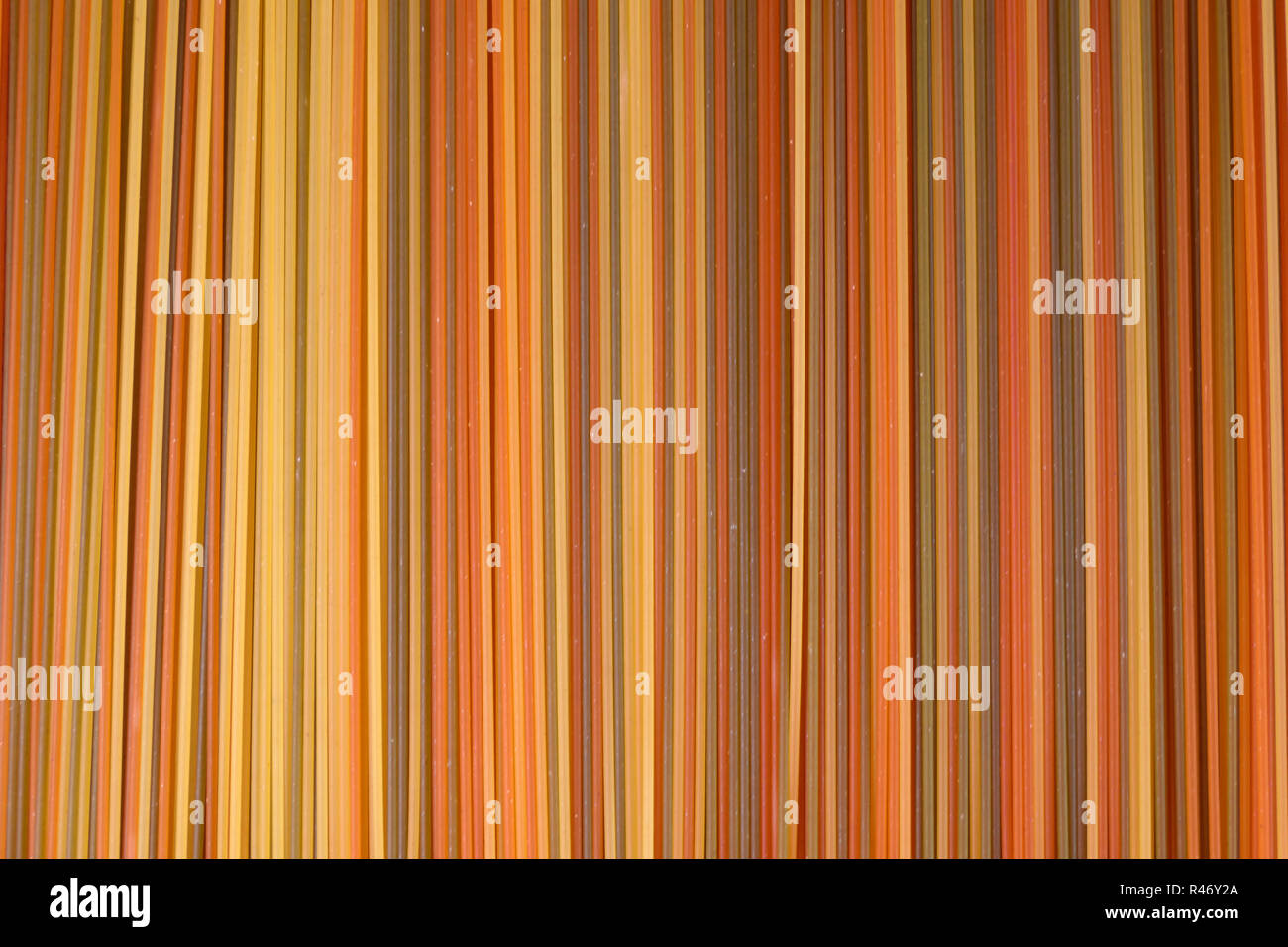 Colorful tricolore spaghetti pasta background Stock Photo - Alamy