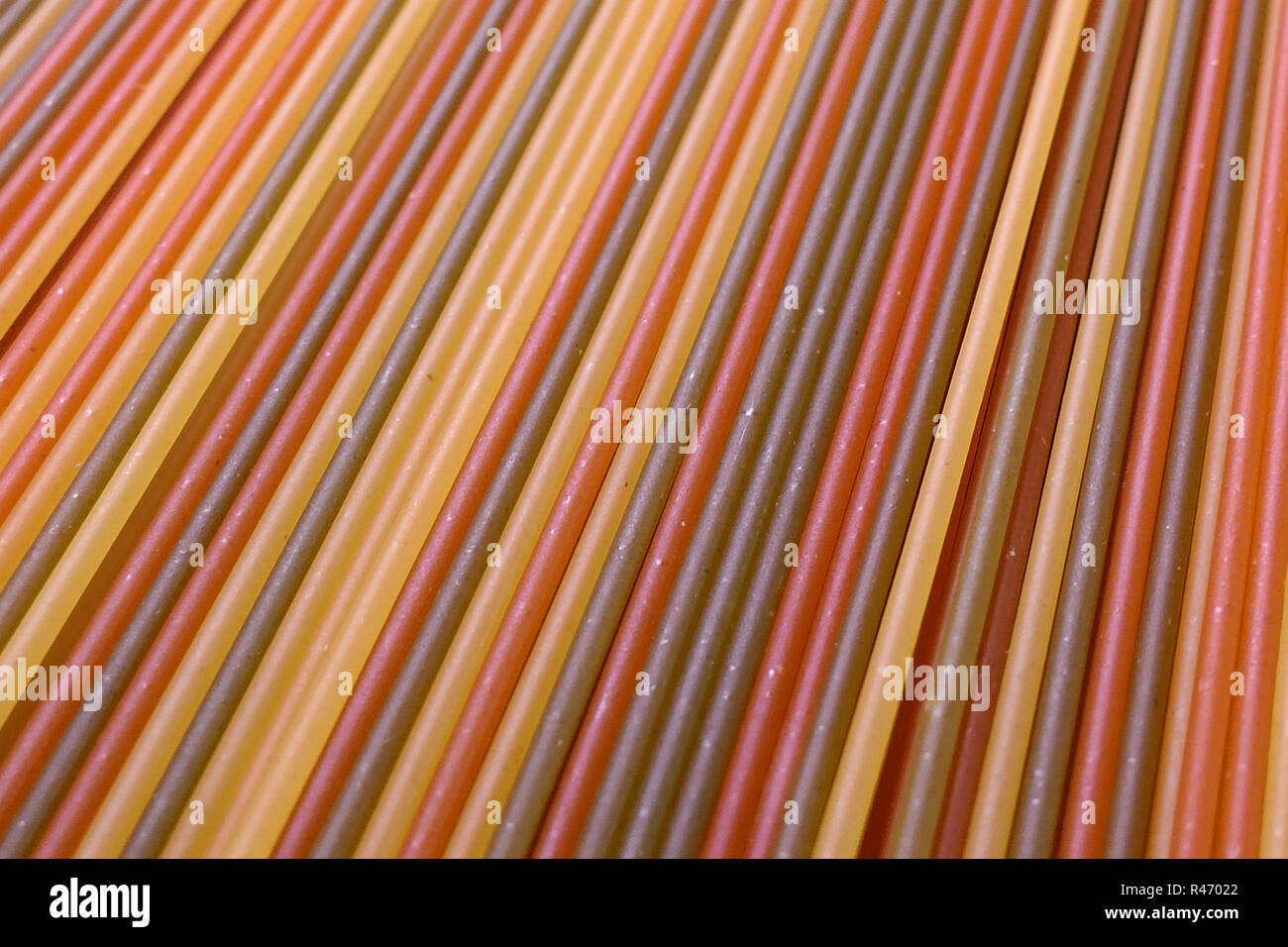 Colorful tricolore spaghetti pasta background Stock Photo - Alamy