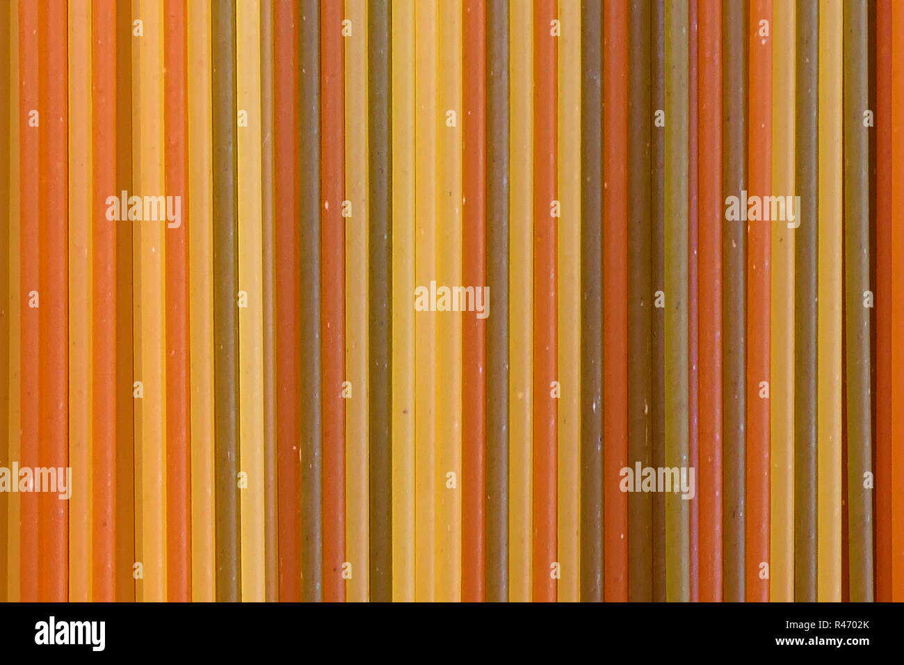 Colorful tricolore spaghetti pasta background Stock Photo - Alamy