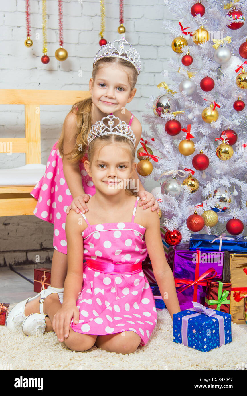 Two girls at the beauty of Christmas trees Stock Photo - Alamy