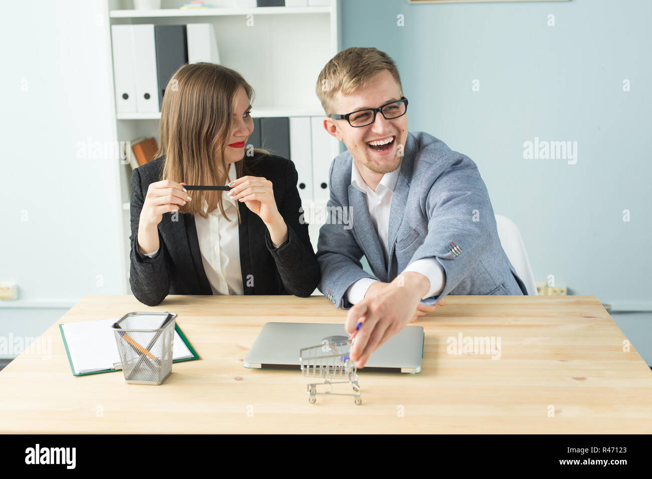 Business, teamwork and people concept - Two workers rest during a break ...