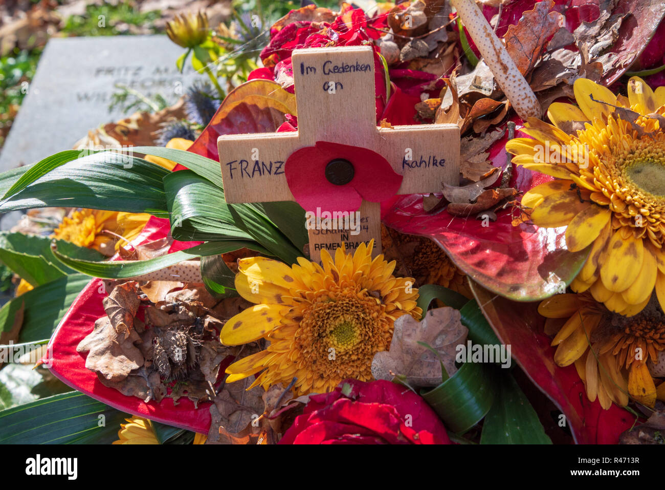 Remembrance cross and floral tributes laid at grave of fallen German ...