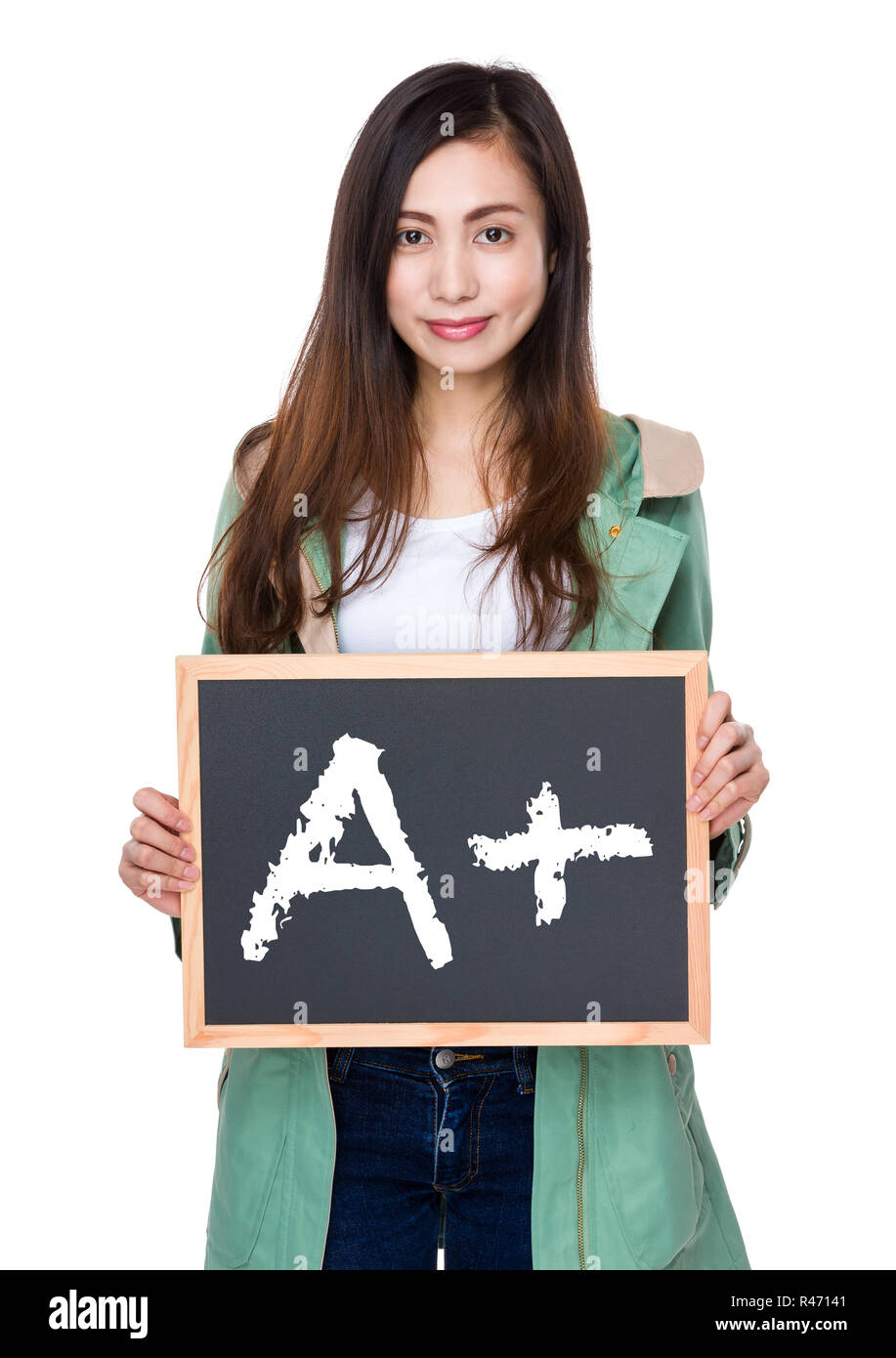 Woman hold with blackboard showing mark A plus Stock Photo - Alamy