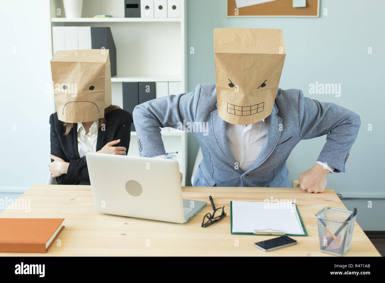 Business, emotions and people concept - Two angry and exhausted workers ...