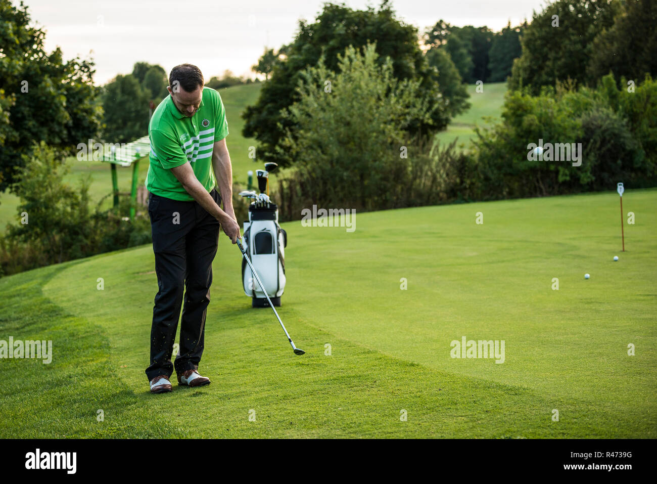 golfers on the golf course Stock Photo - Alamy