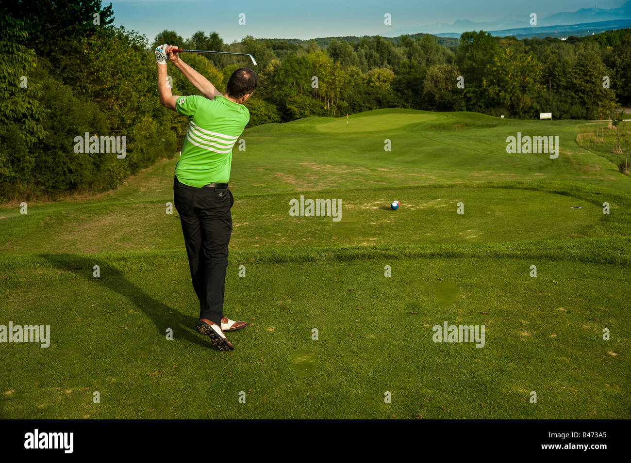 golfers on the golf course Stock Photo - Alamy