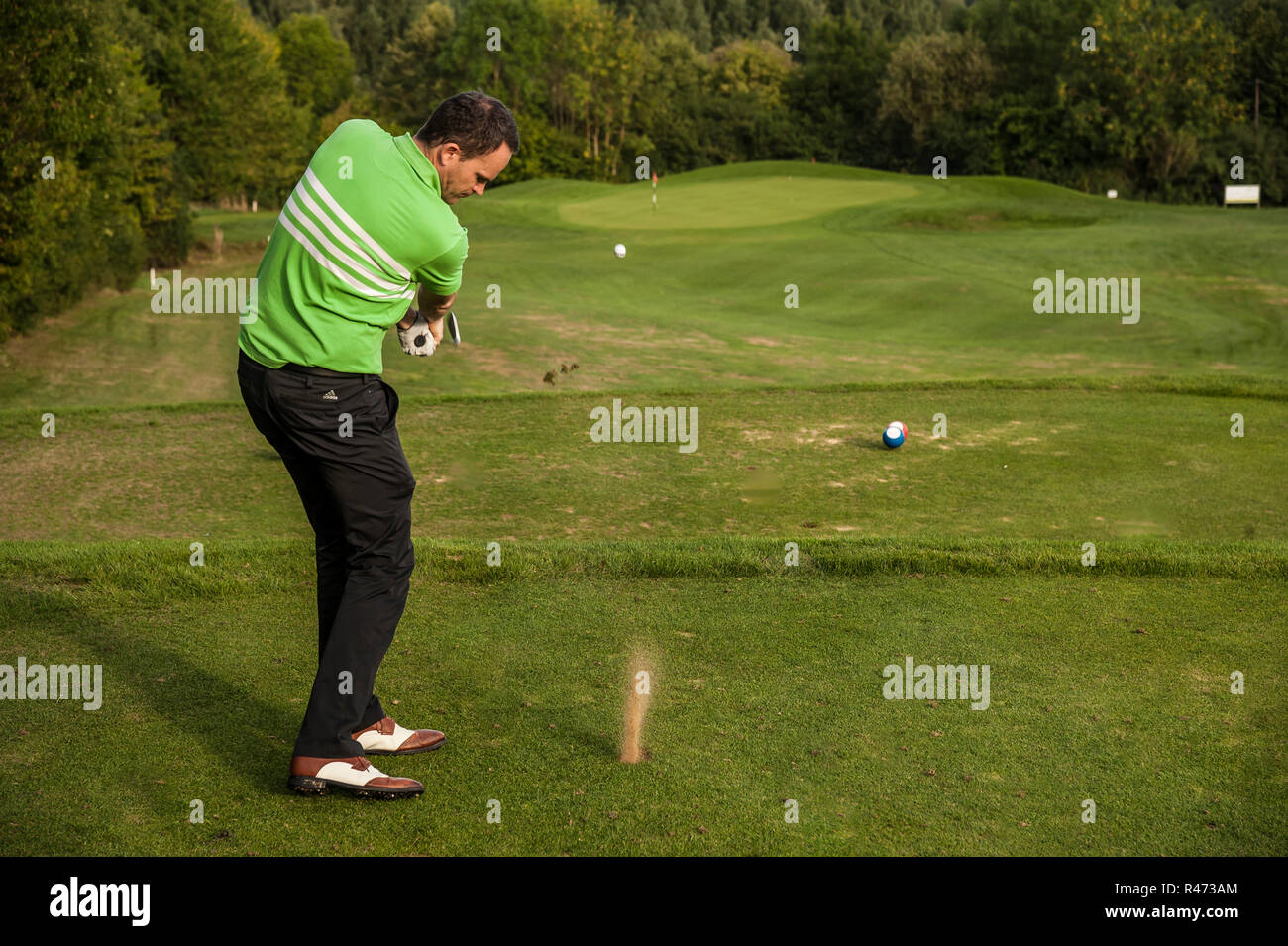 golfers on the golf course Stock Photo - Alamy