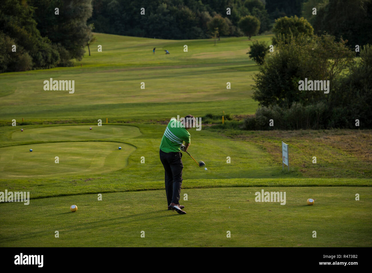 golfers on the golf course Stock Photo - Alamy