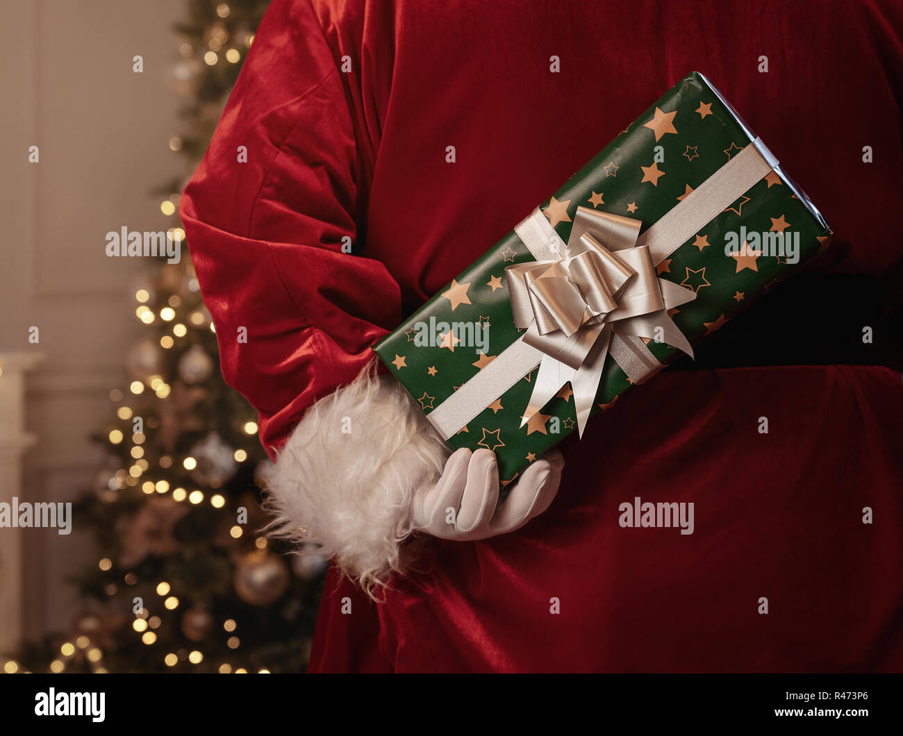 Santa claus christmas tree gift hi-res stock photography and images - Alamy