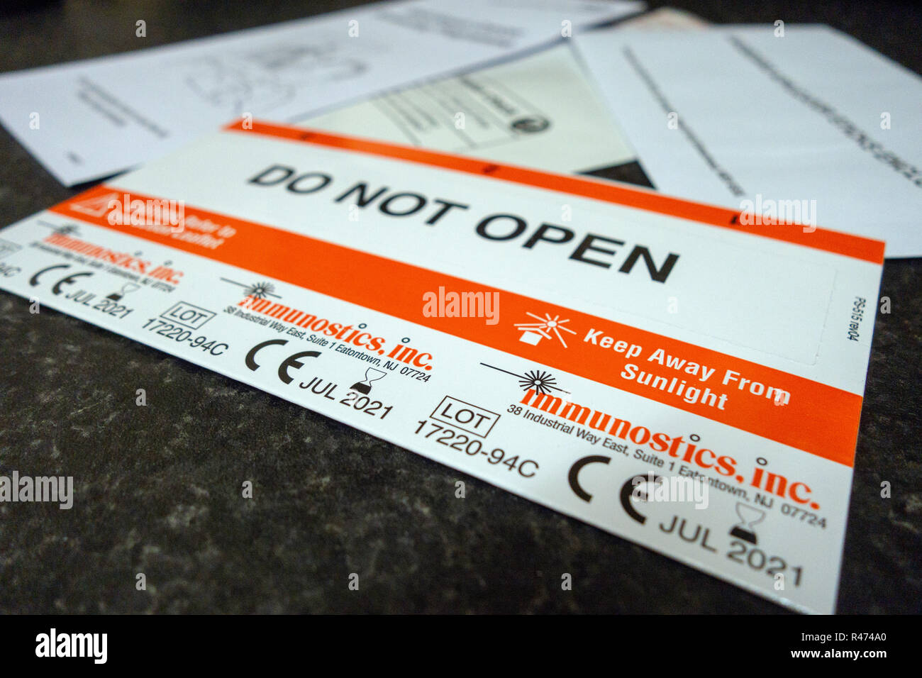 Closeup of the NHS Bowel Cancer home testing kit Do Not Open Stock ...