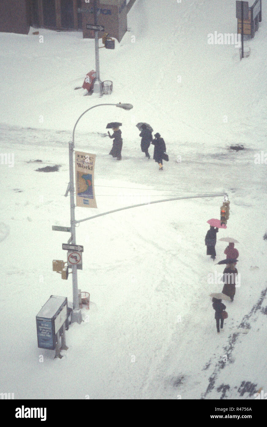 New Yorkers trudge their way through unplowed streets during a ...