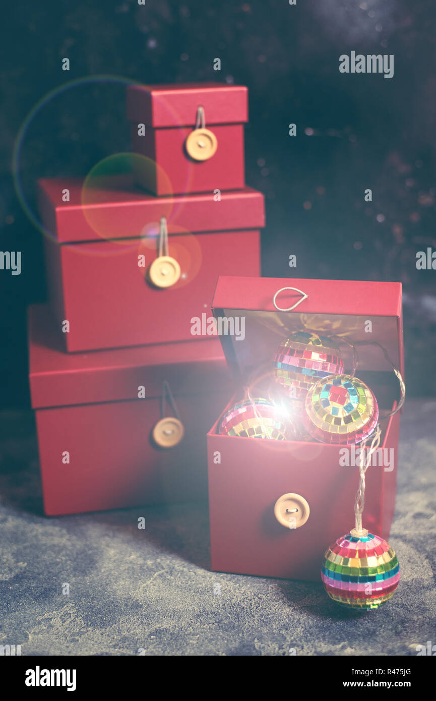 Red Christmas gift box with gold magic lights Stock Photo - Alamy