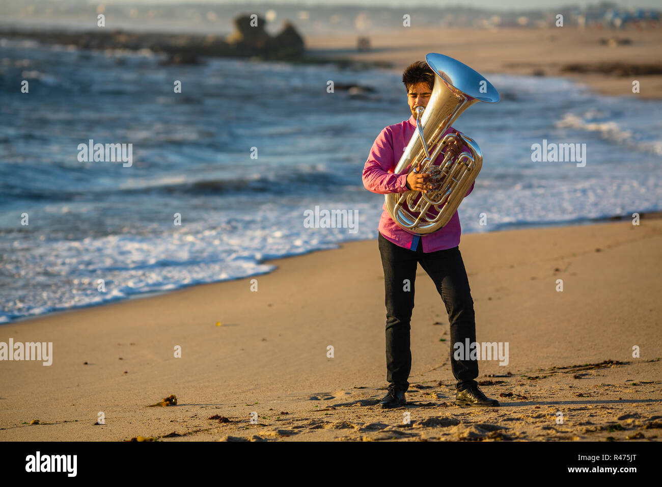 Musician playing the Tuba on the sea coast Stock Photo - Alamy