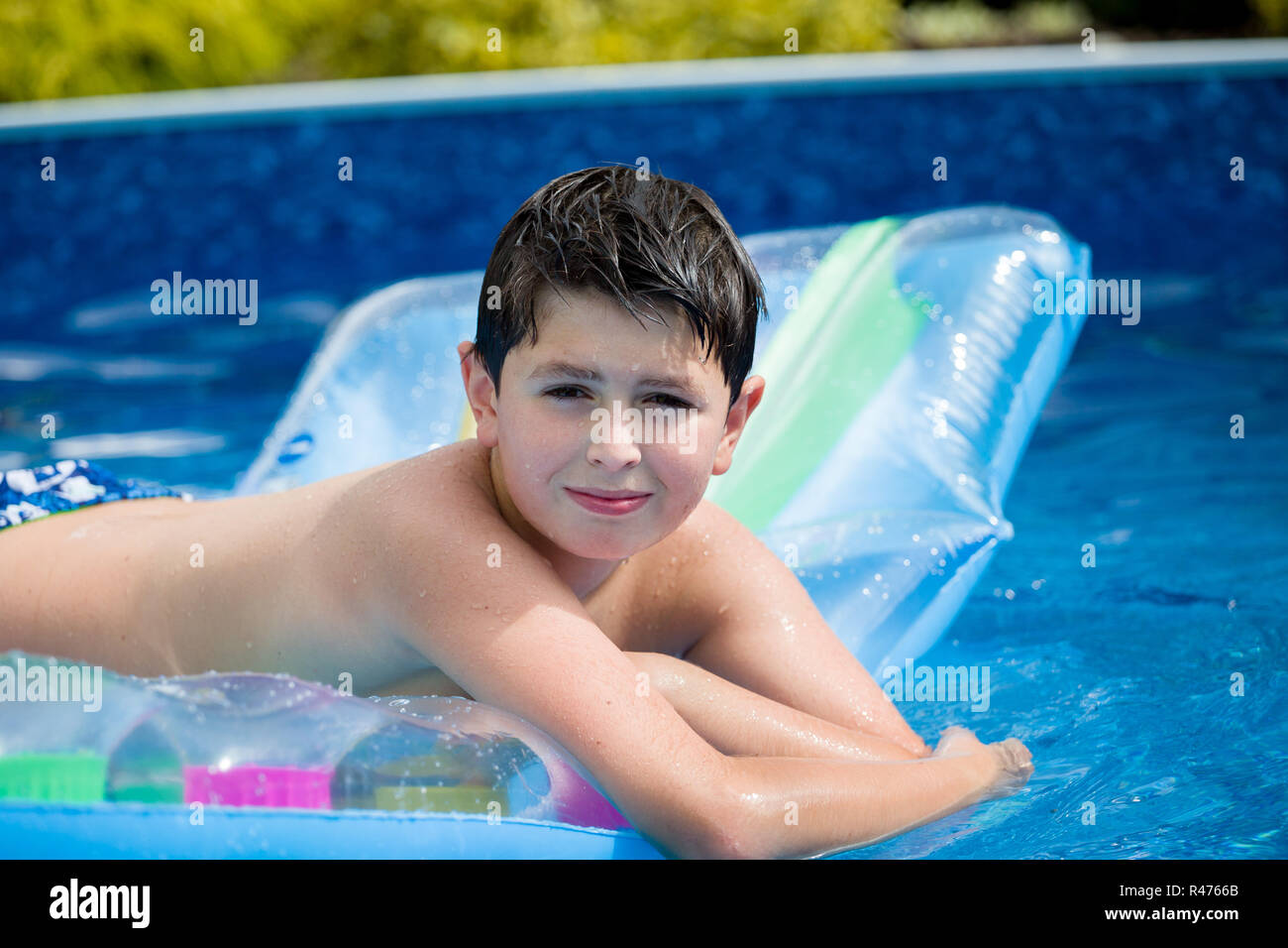 Boy in swimming pool Stock Photo - Alamy