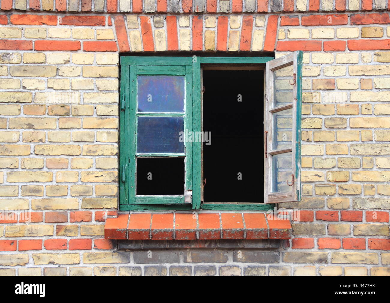 Open window with green frame and missing glass Stock Photo - Alamy