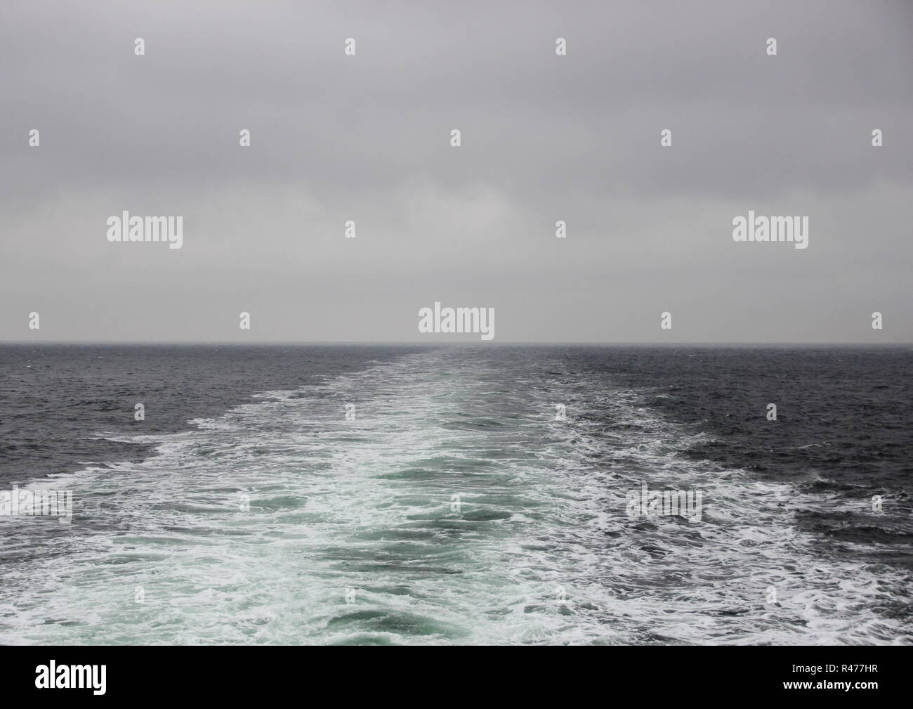 Ship water trace and trail with cloudy horizon Stock Photo - Alamy