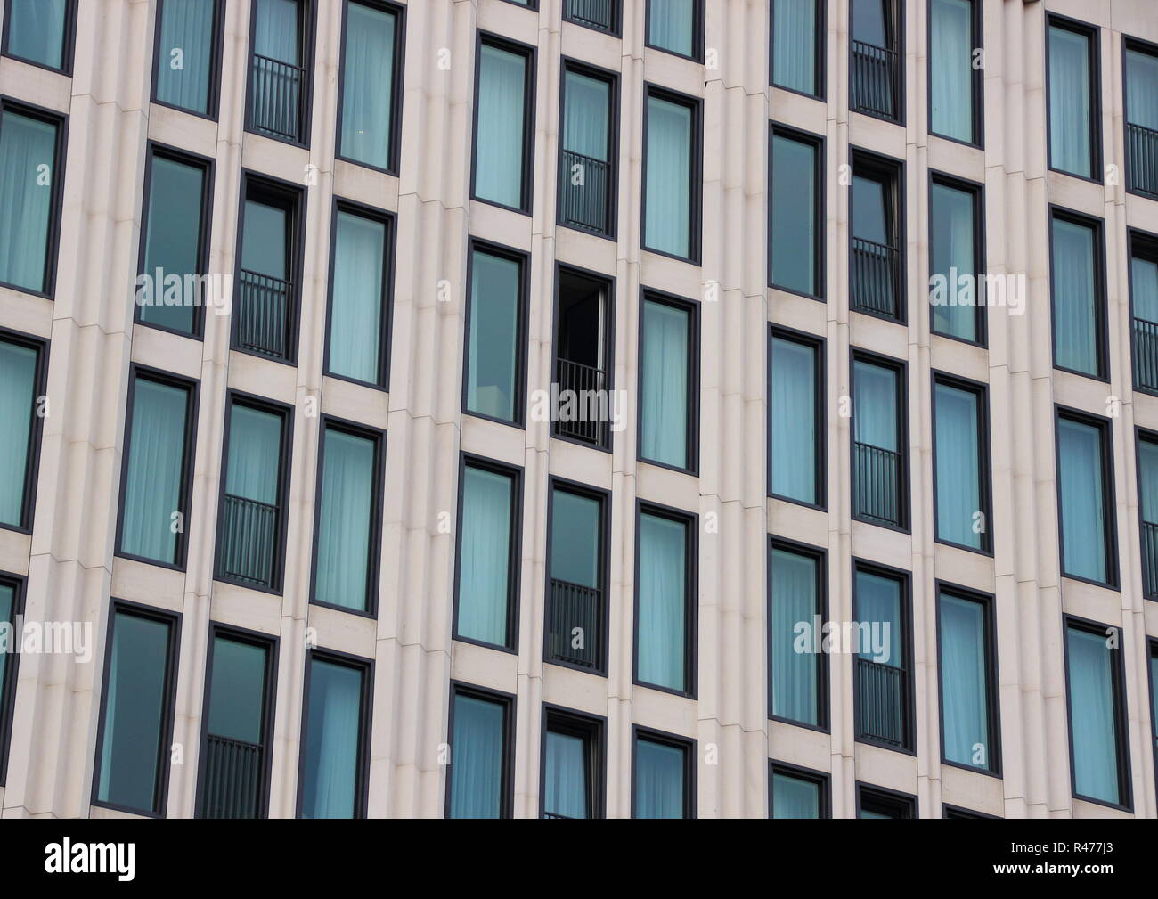Perspective of building facade with one open window Stock Photo - Alamy