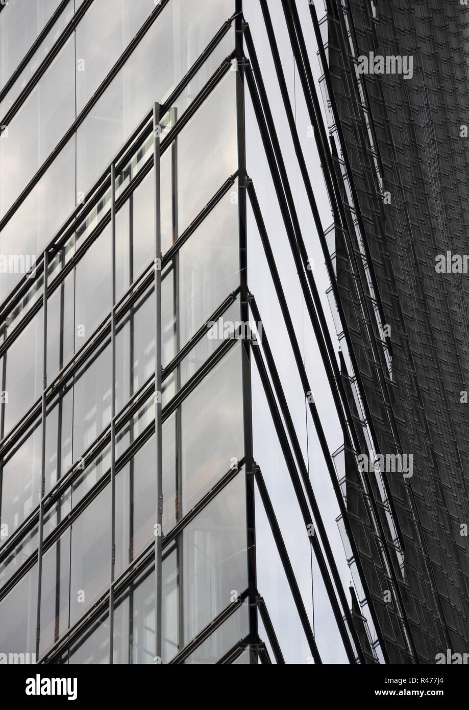 Abstract of modern building glass corner facade Stock Photo - Alamy