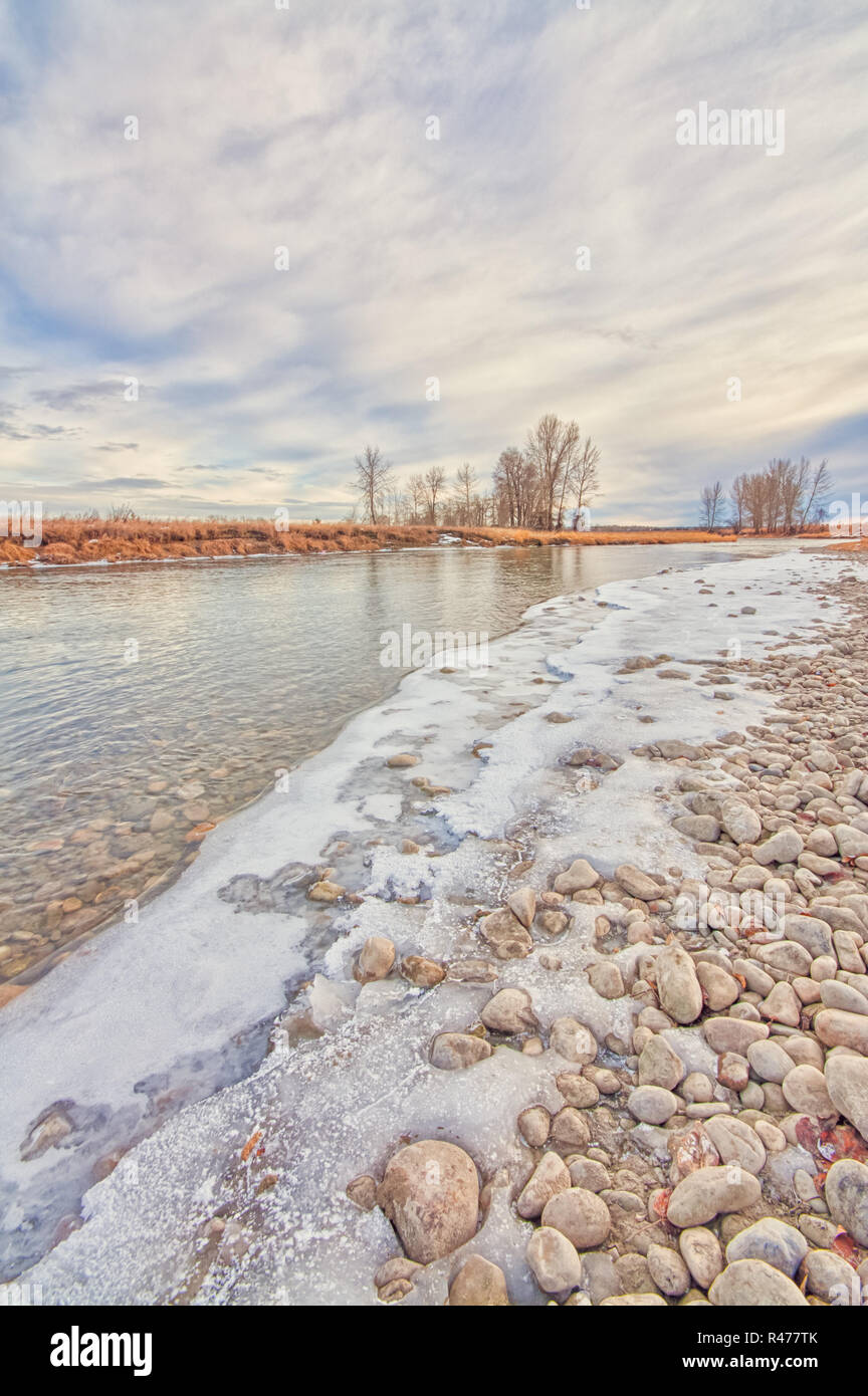 Snowy Rocky River Bank Stock Photo - Alamy