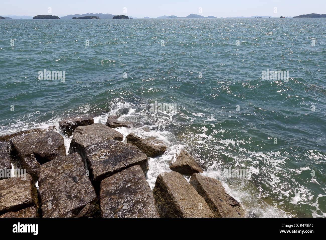 Rocky breakwater serene beach hi-res stock photography and images - Alamy