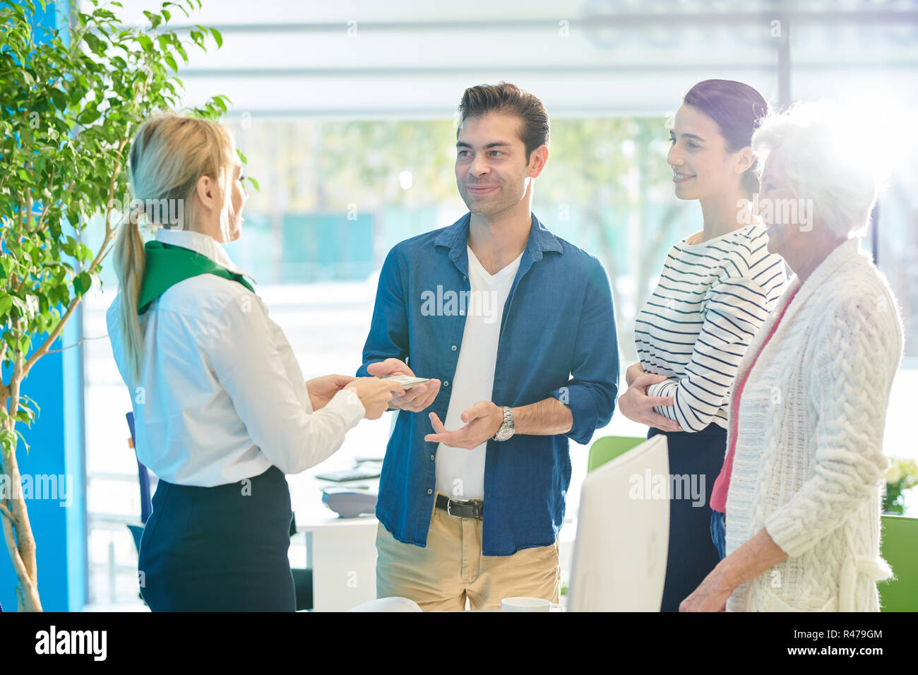 Happy woman receiving money hi-res stock photography and images - Alamy