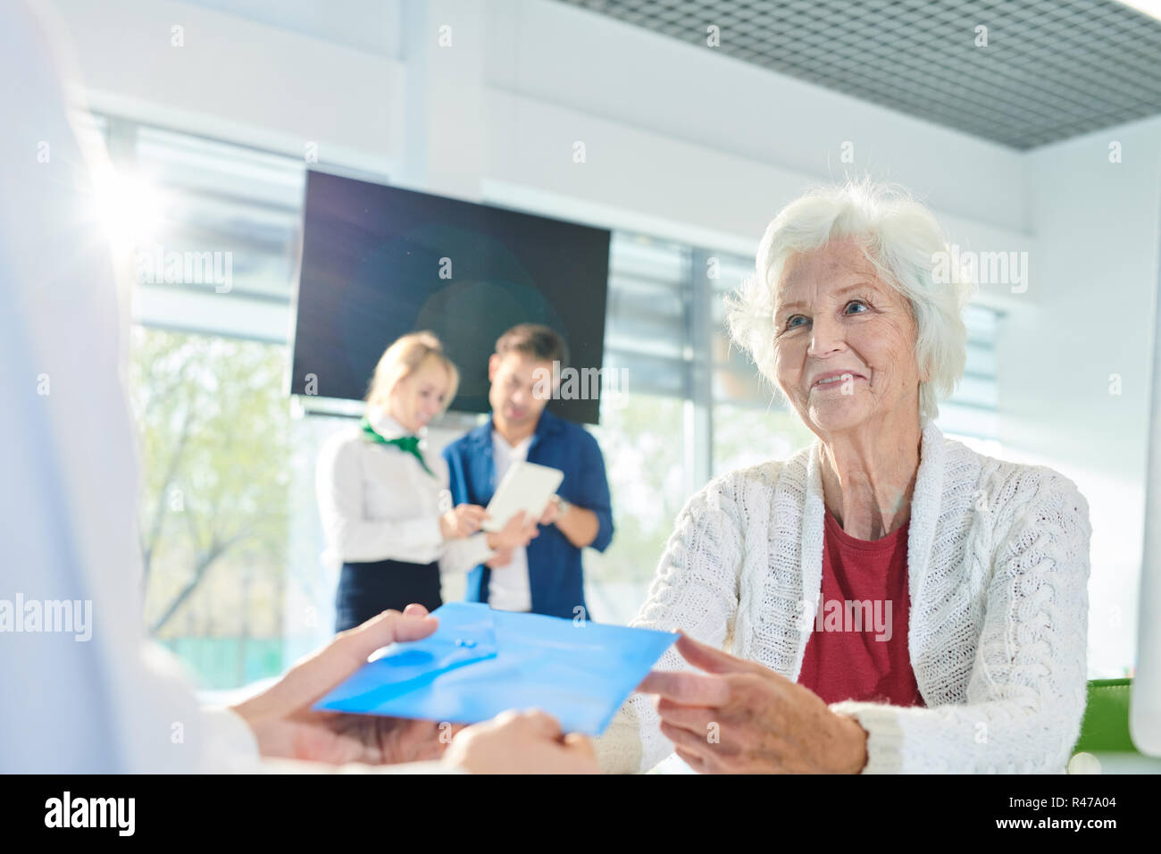 Elderly client documents hi-res stock photography and images - Alamy