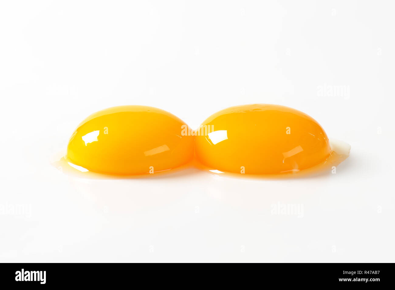 Raw egg yolks Stock Photo - Alamy