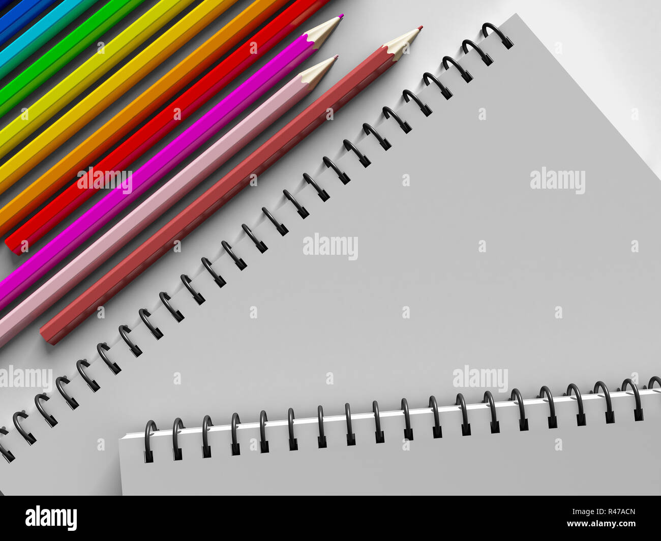 notebook with colored pencils on White background Stock Photo - Alamy