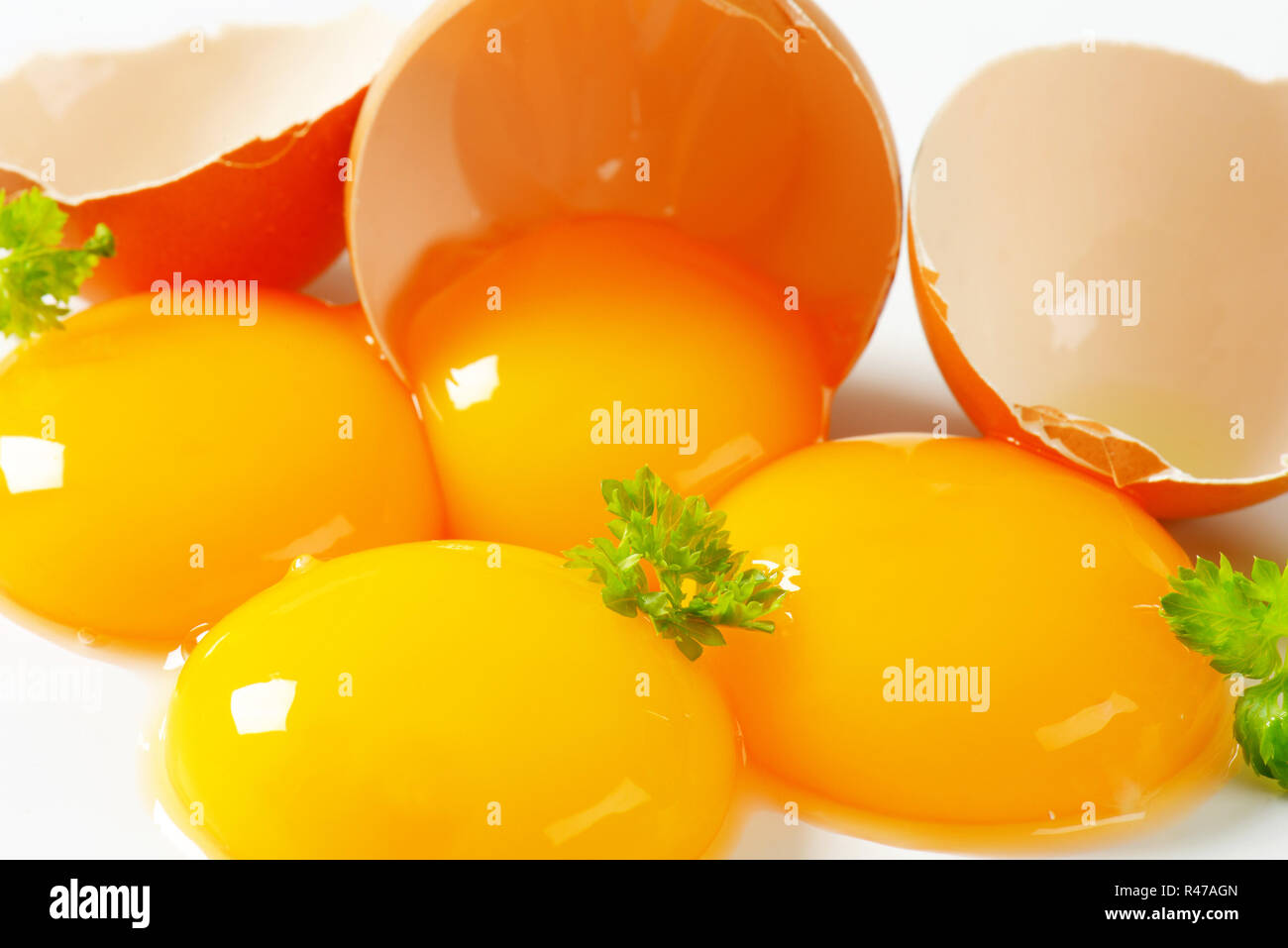 Raw egg yolks Stock Photo - Alamy