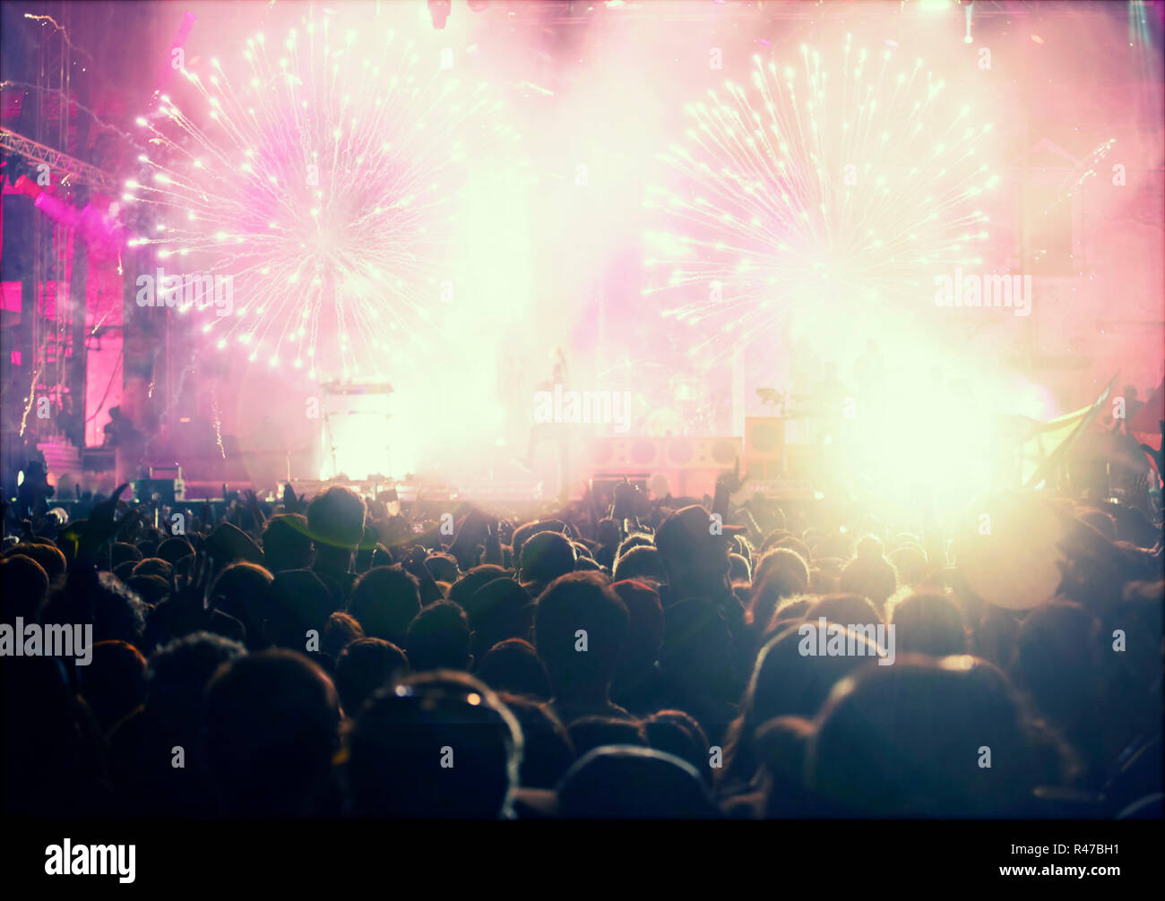 New Year concept - cheering crowd and fireworks Stock Photo - Alamy