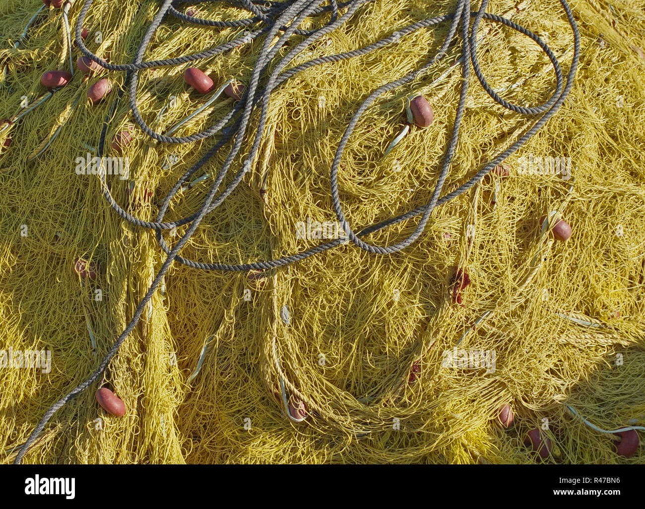 yellow fishing net in a greek port Stock Photo - Alamy