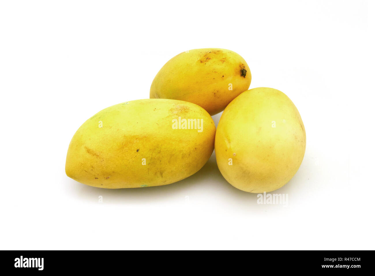 Yellow mangoes backdrop Cut Out Stock Images & Pictures - Alamy
