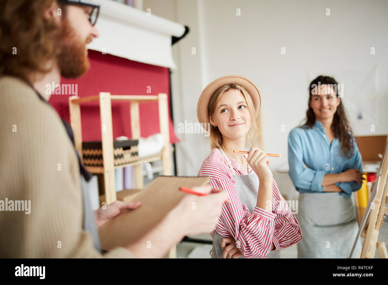 Talking to groupmate Stock Photo - Alamy