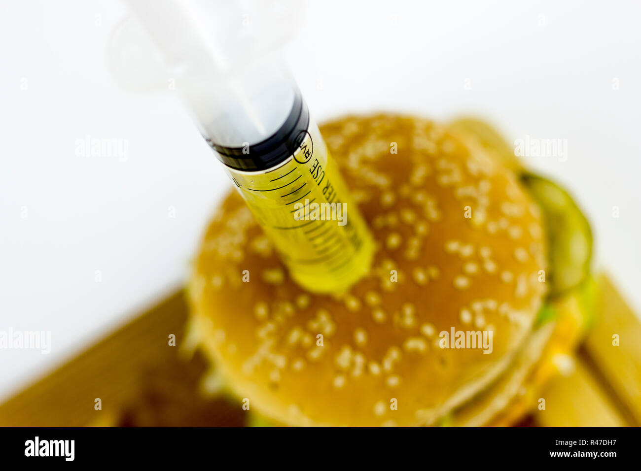 Syringe in a hamburger Stock Photo - Alamy