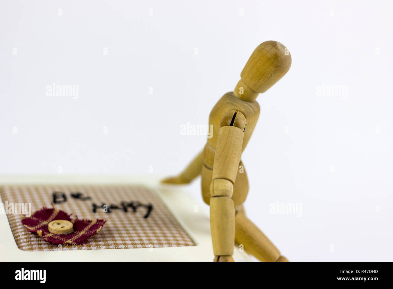Wooden puppet sitting on a jewellery box Stock Photo - Alamy