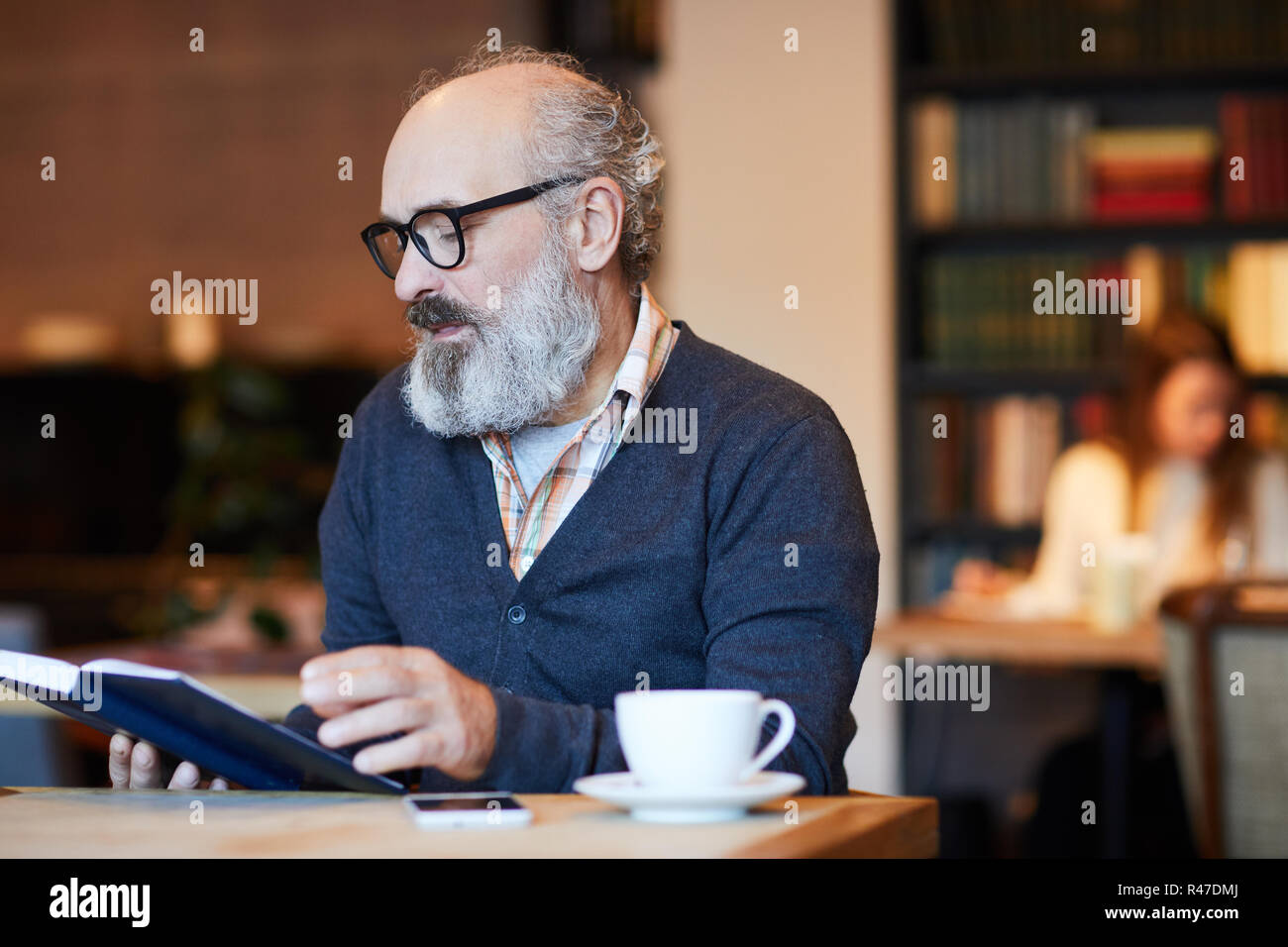 Bearded mature man reading hi-res stock photography and images - Alamy