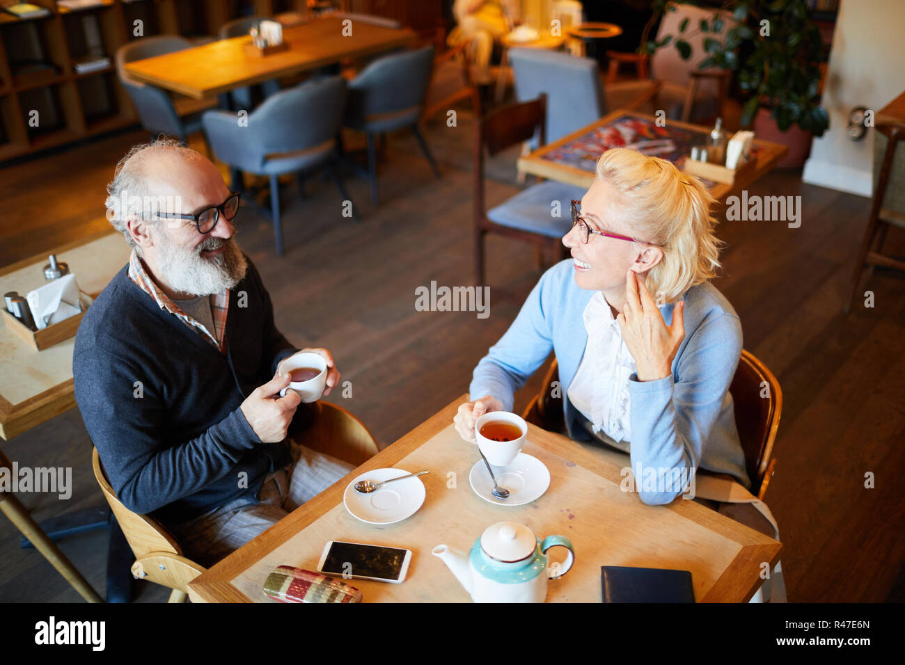 Conversation by cup of tea Stock Photo - Alamy