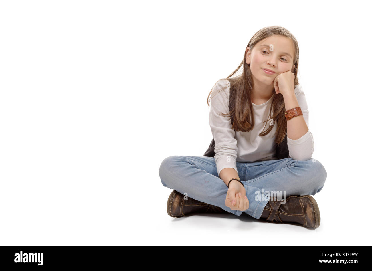 Young girl sitting crosslegged hi-res stock photography and images - Alamy
