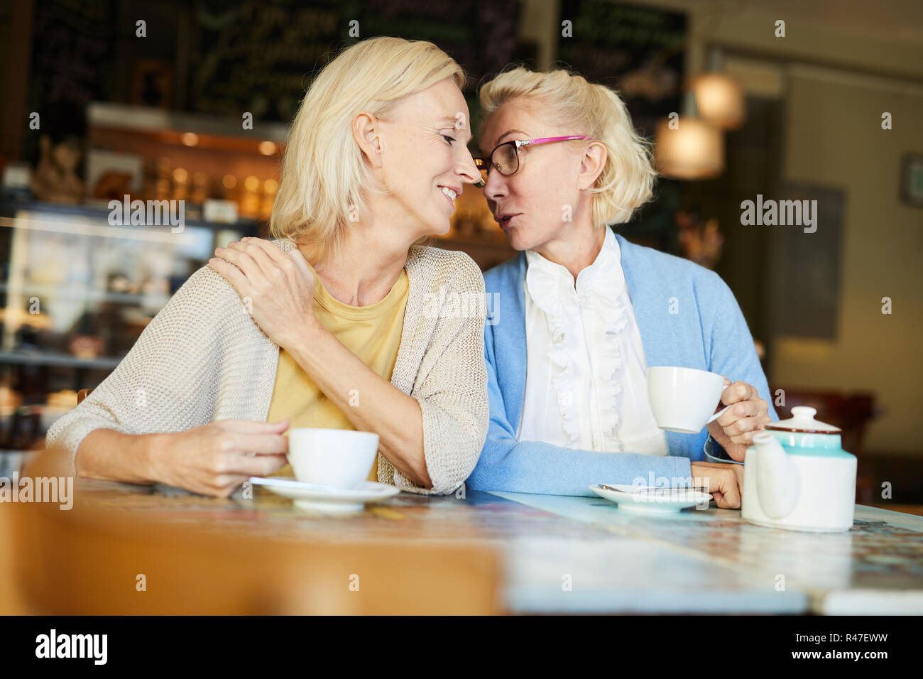 Woman sharing secret hi-res stock photography and images - Alamy