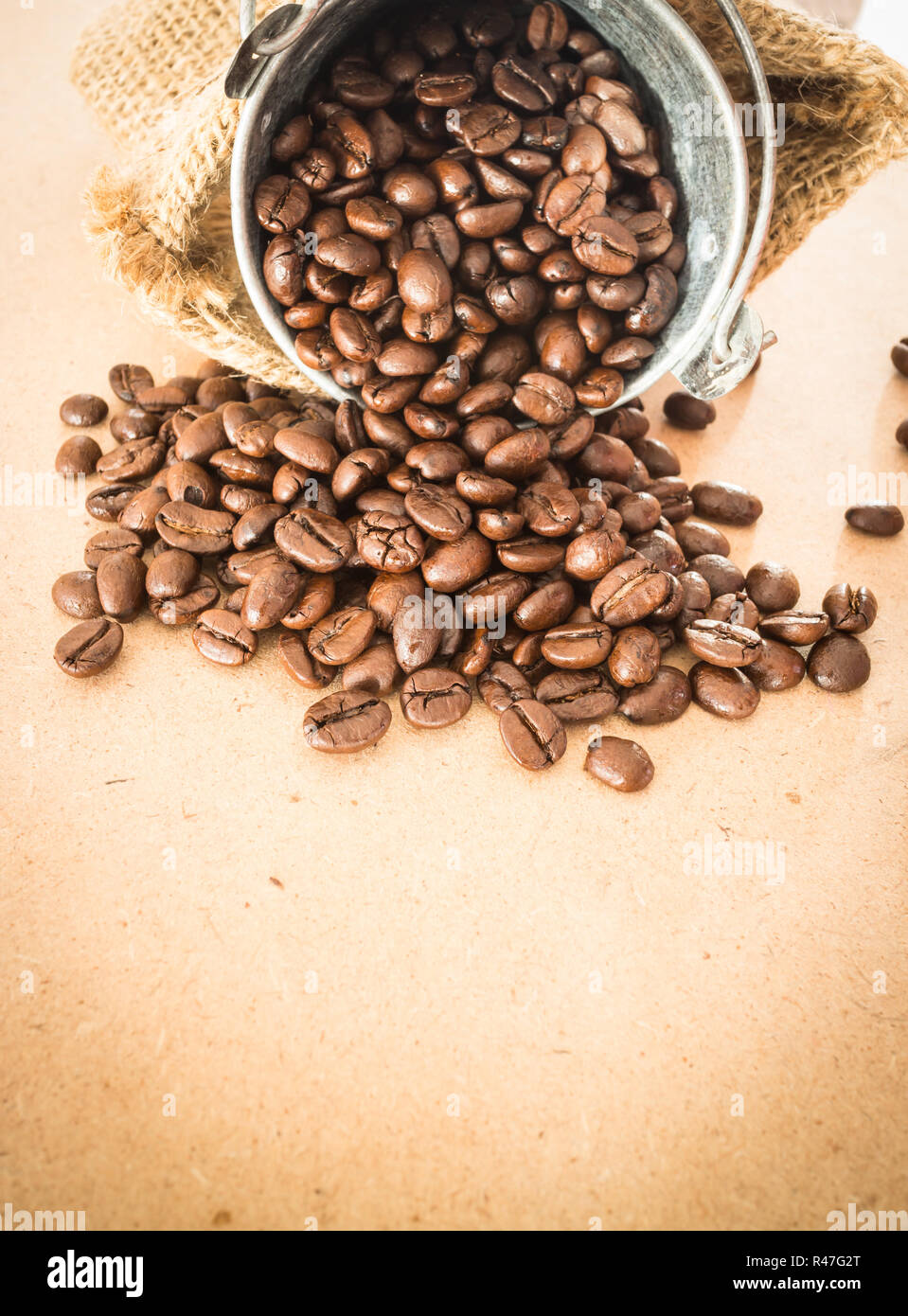 Coffee roasted bean in the bucket on wooden background Stock Photo - Alamy