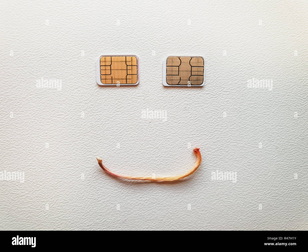 two micro sim cards lying in the shape of a smiling face Stock Photo ...